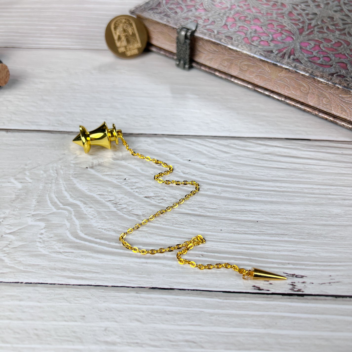 Golden point and dome dowsing metal pendulum with a spike charm ...