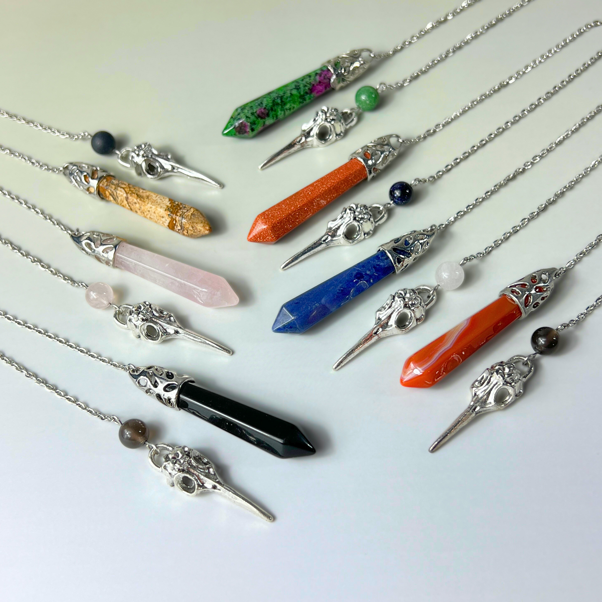Bird skull dowsing pendulum, multiple gemstones – Baguette Magick