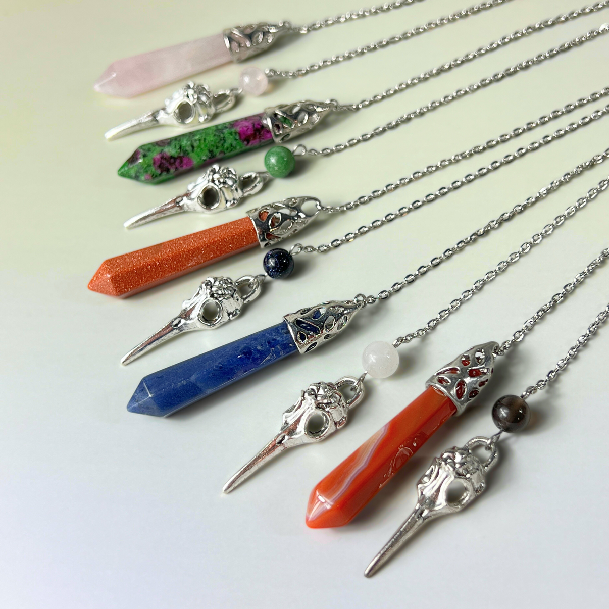 Bird skull dowsing pendulum, multiple gemstones – Baguette Magick