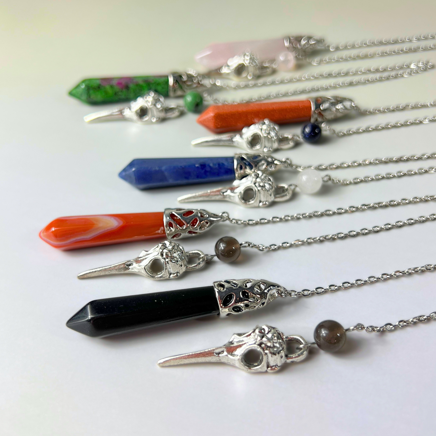Bird skull dowsing pendulum, multiple gemstones – Baguette Magick