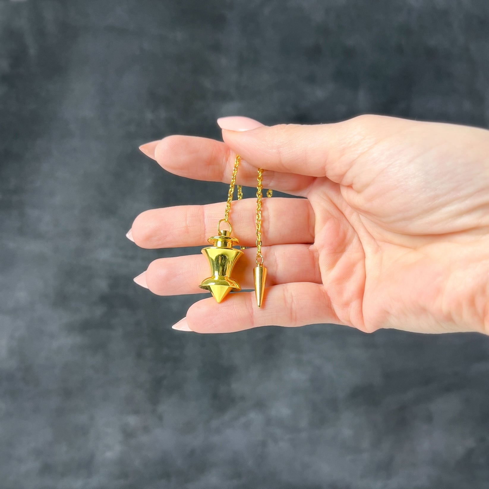 Golden point and dome dowsing metal pendulum with a spike charm ...