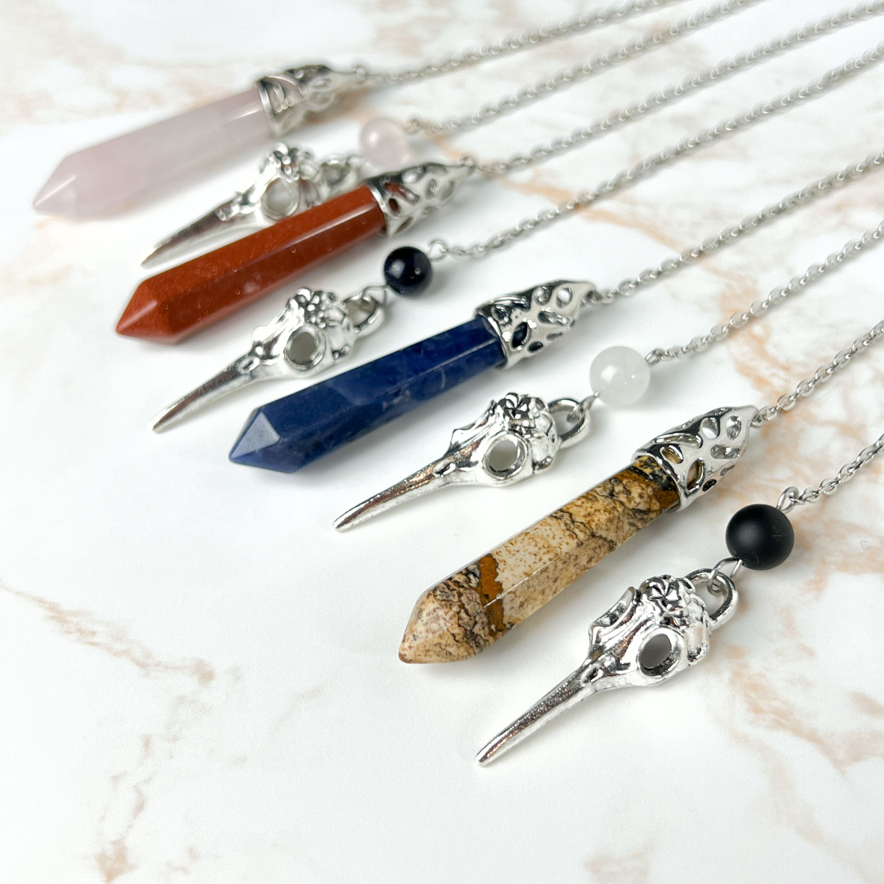 Bird skull dowsing pendulum, multiple gemstones – Baguette Magick