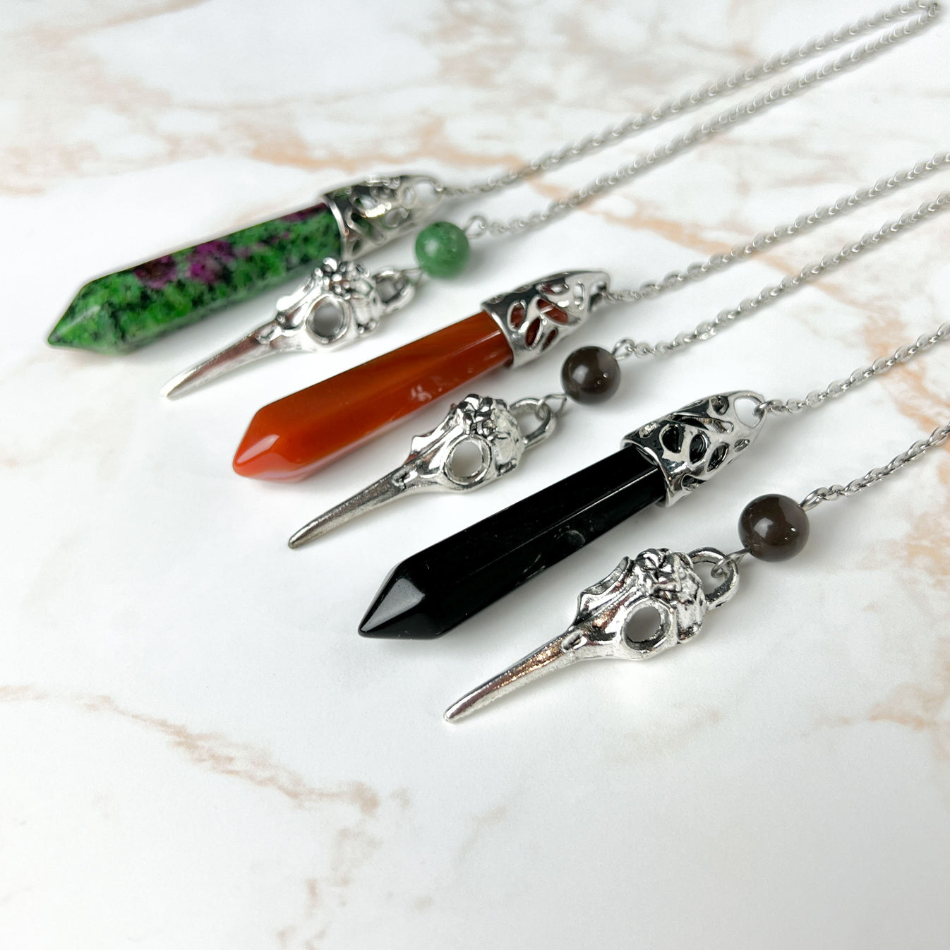 Bird skull dowsing pendulum, multiple gemstones – Baguette Magick